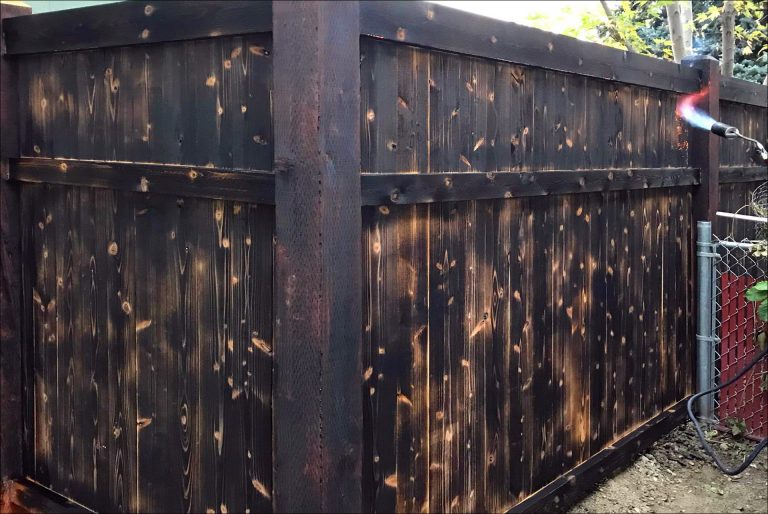 Custom Wood Fence With Dark Burnt Textures - Johnson Construction